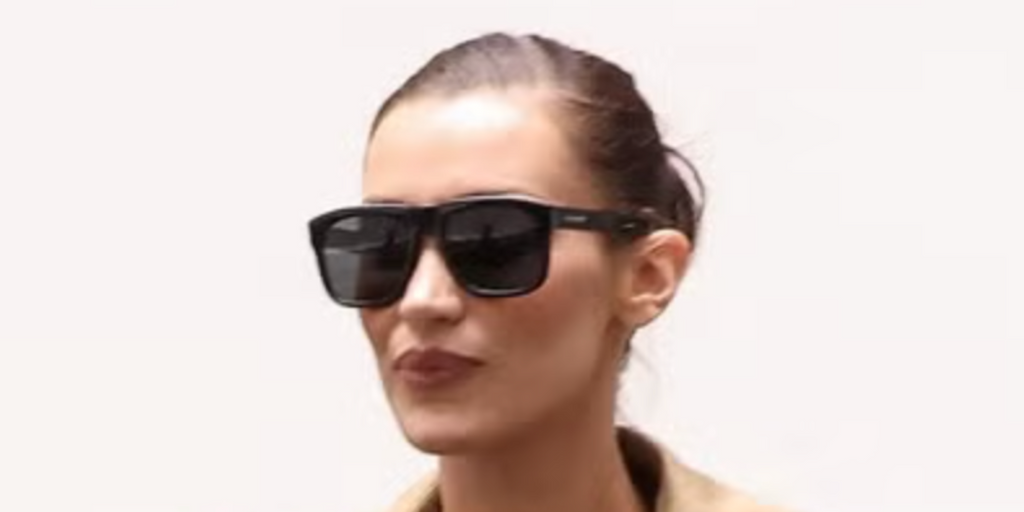 Bella Hadid wears Saint Laurent Sun SL 558 003 black oversized ...